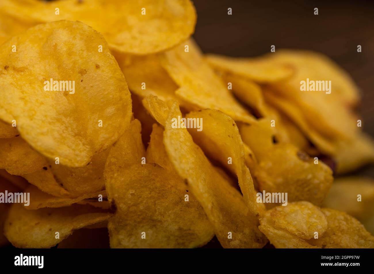 Potato chips scattered on the table, close-up, selective focus Stock ...