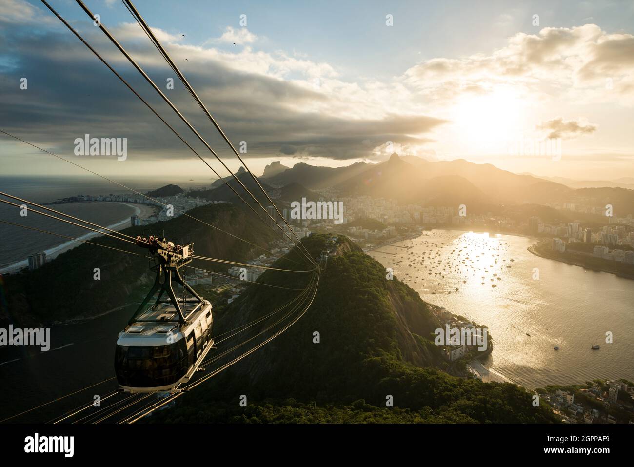 Brazil, Rio de Janeiro, Cable car on Sugarloaf Mountain at sunset Stock ...