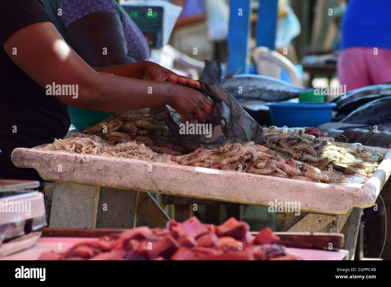 Fish selling procedure on open market Stock Photo - Alamy
