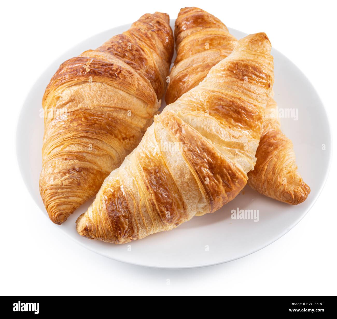 Tasty crusty croissants on the plate on white background. File contains ...