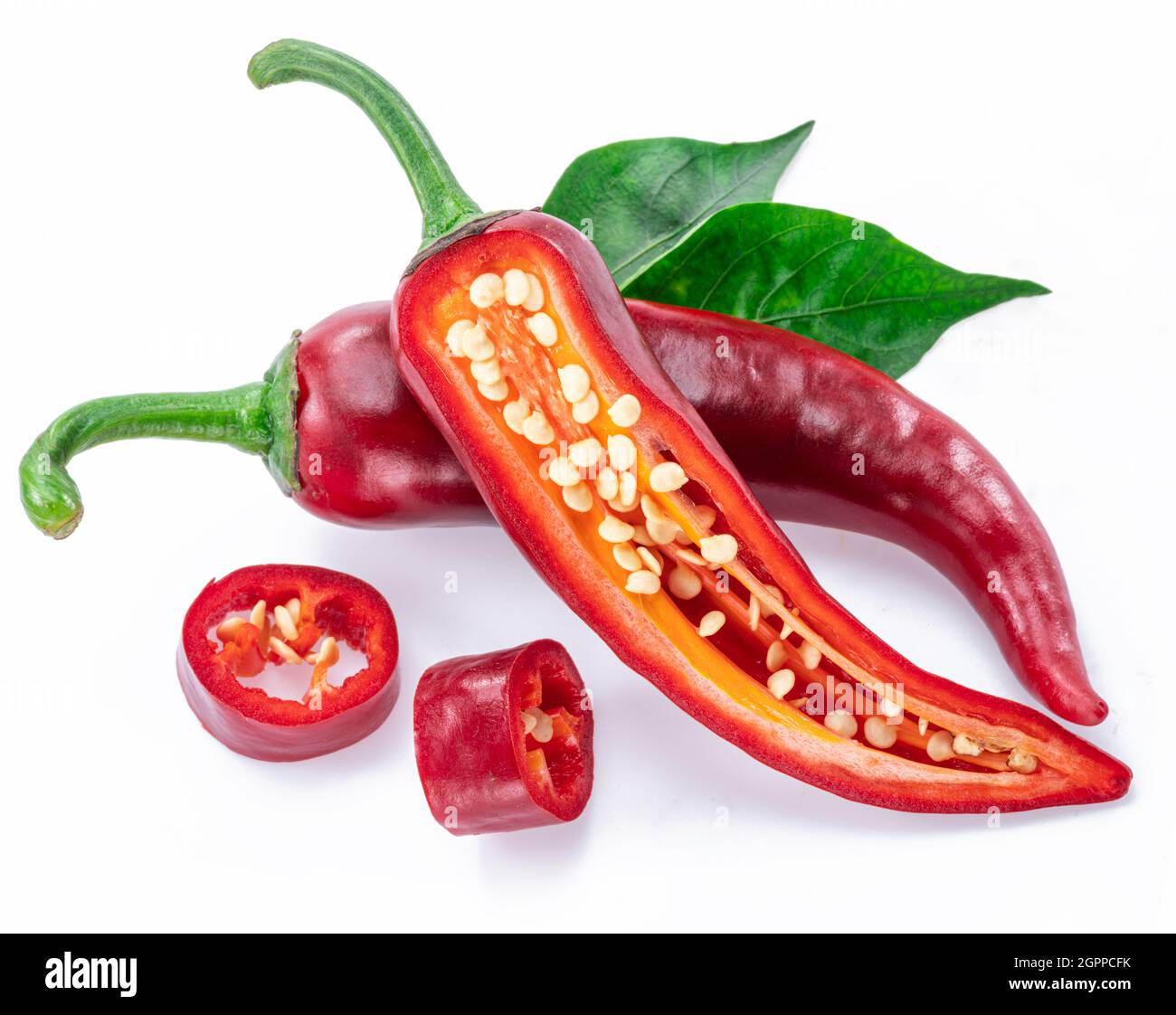 Fresh red chilli pepper and cross sections of chilli pepper with seeds ...