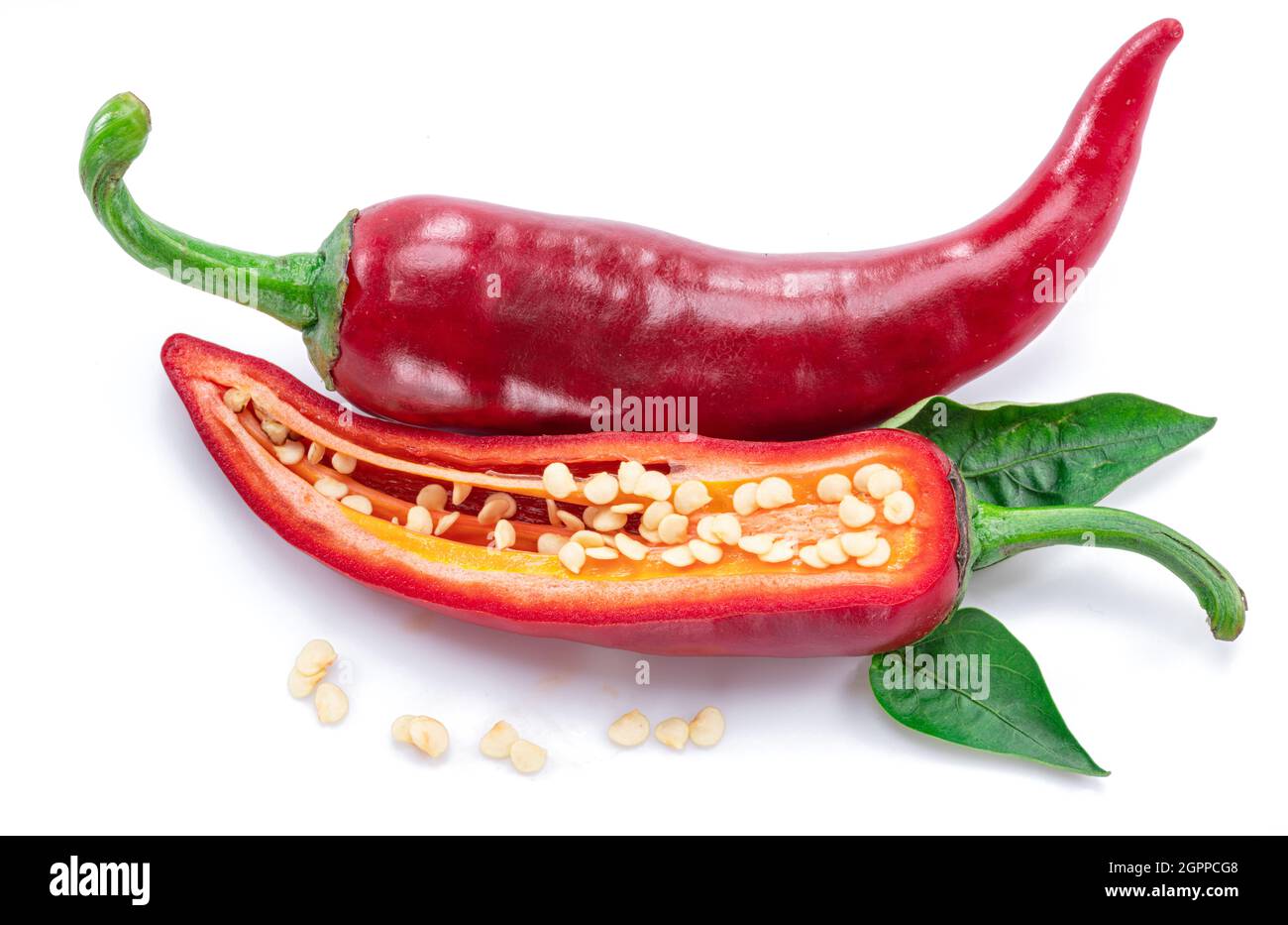 Fresh red chilli pepper and cross section of chilli pepper with seeds ...