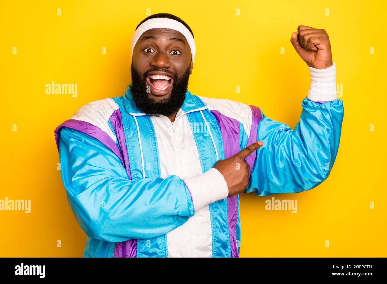 Photo of young african man happy positive smile point finger muscles ...