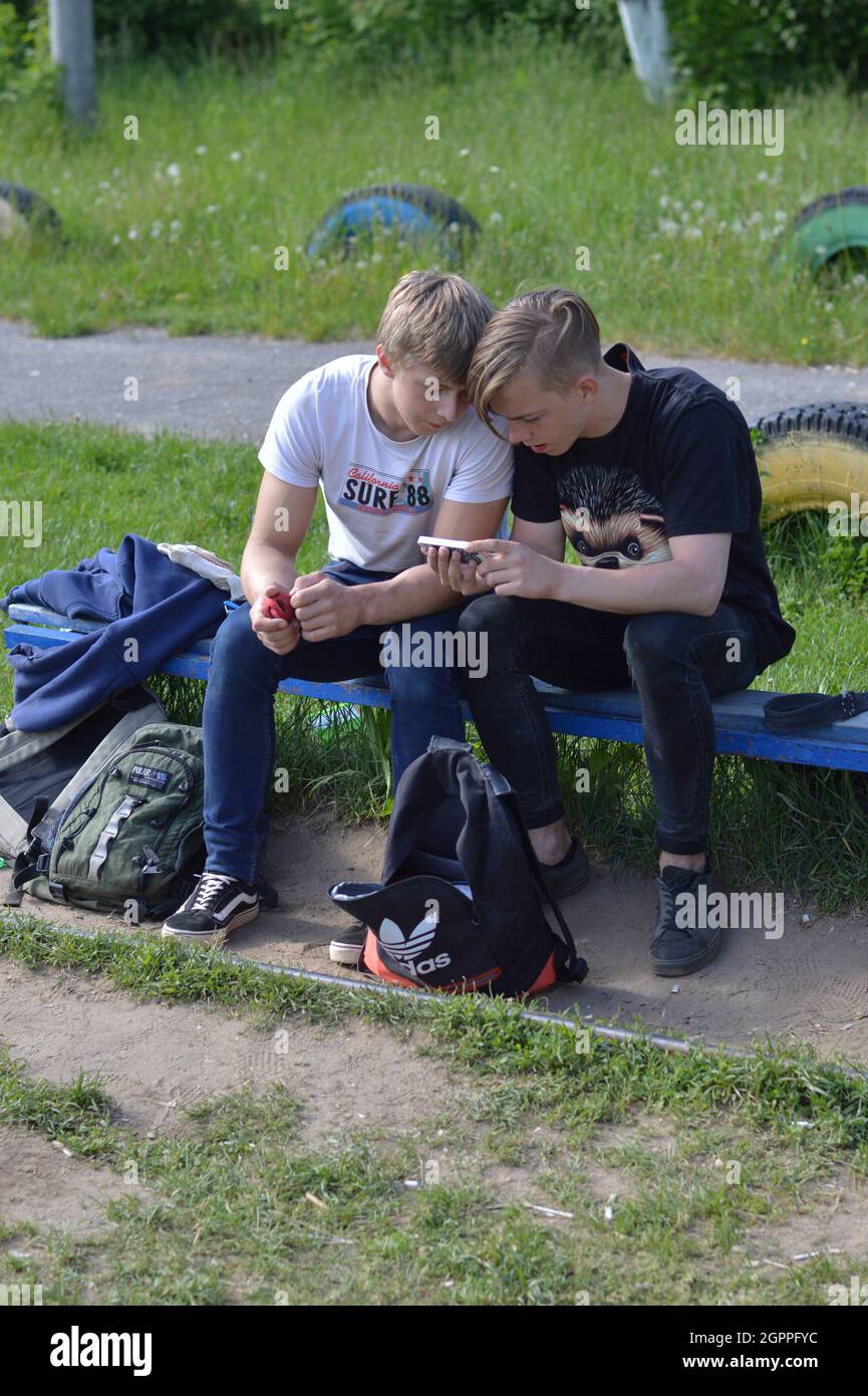 Kovrov, Russia. 11 June 2017. Teens who are engaged in discipline gimbarr resting on bench in ...