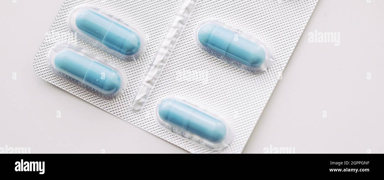 Blue pills and capsules as nutrition supplement, wellness and health ...