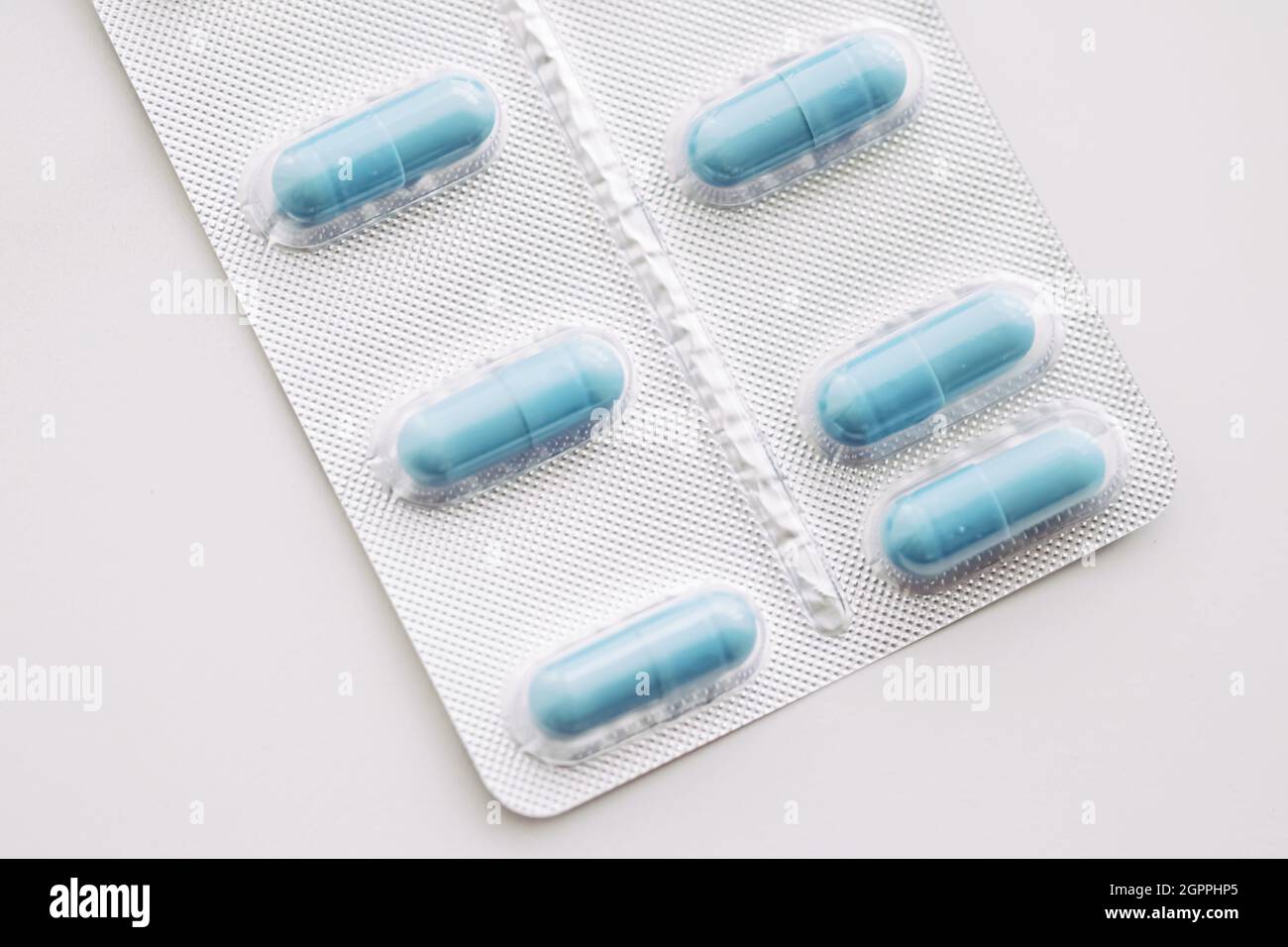 Blue pills and capsules as nutrition supplement, wellness and health ...