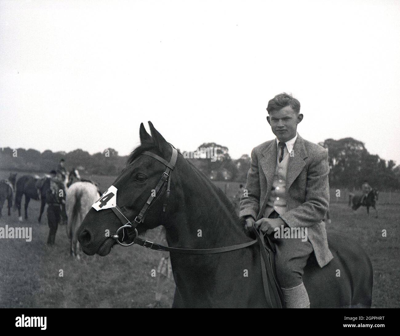 1950s, historical, outside in a field at at an equestrian event, a ...