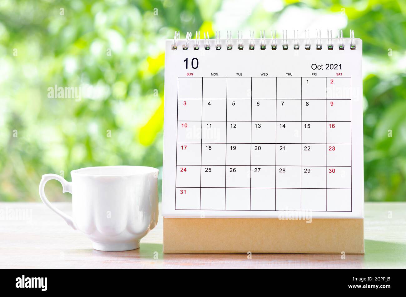 October 2021 Calendar desk for organizer to plan and reminder on wooden ...