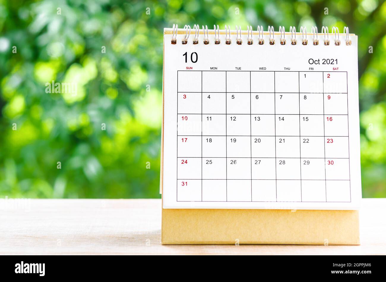 October 2021 Calendar desk for organizer to plan and reminder on wooden ...
