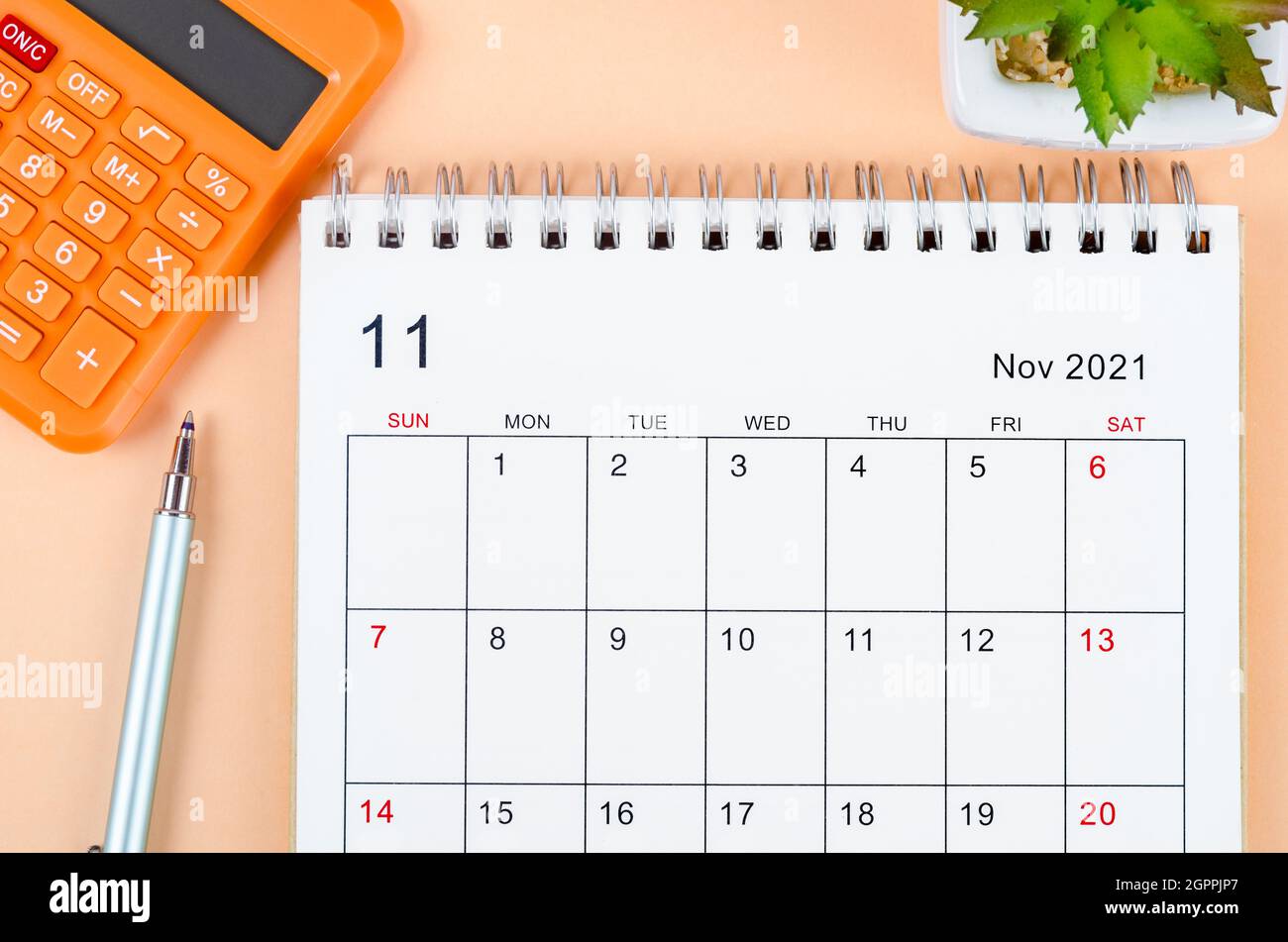November 2021 desk calendar with calculator on beautiful background ...