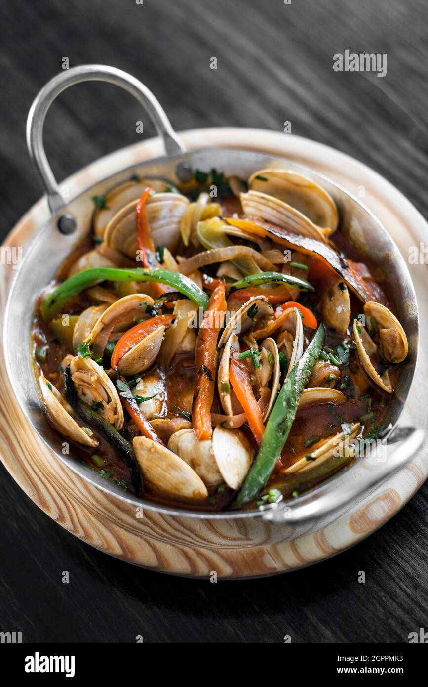 spanish mediterranean clam and vegetable stew in pot at barcelona ...