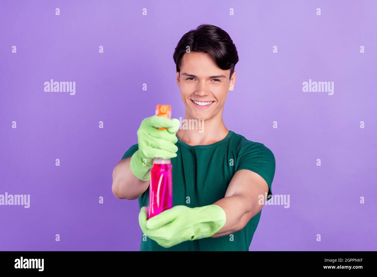 Photo of cheerful positive happy man hold cleaner chemical shoot you ...