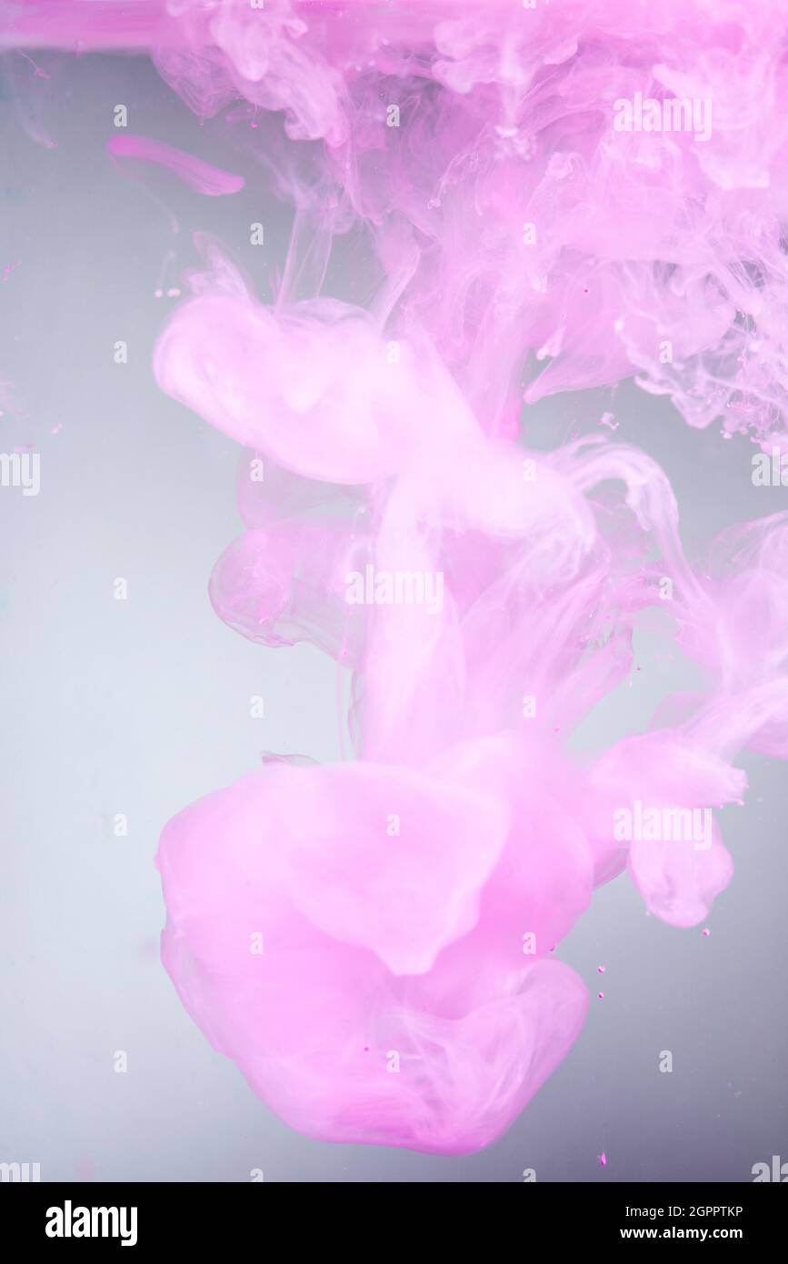 Coloured shapes and flows in liquid Stock Photo - Alamy