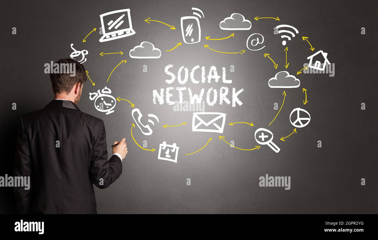 businessman drawing social media icons Stock Photo - Alamy