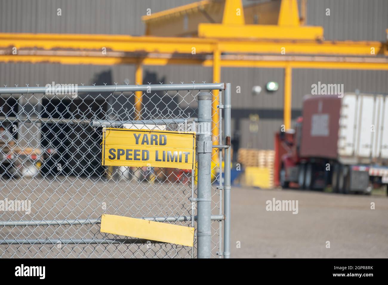 Safety sign on factory fence in industrial area Stock Photo - Alamy
