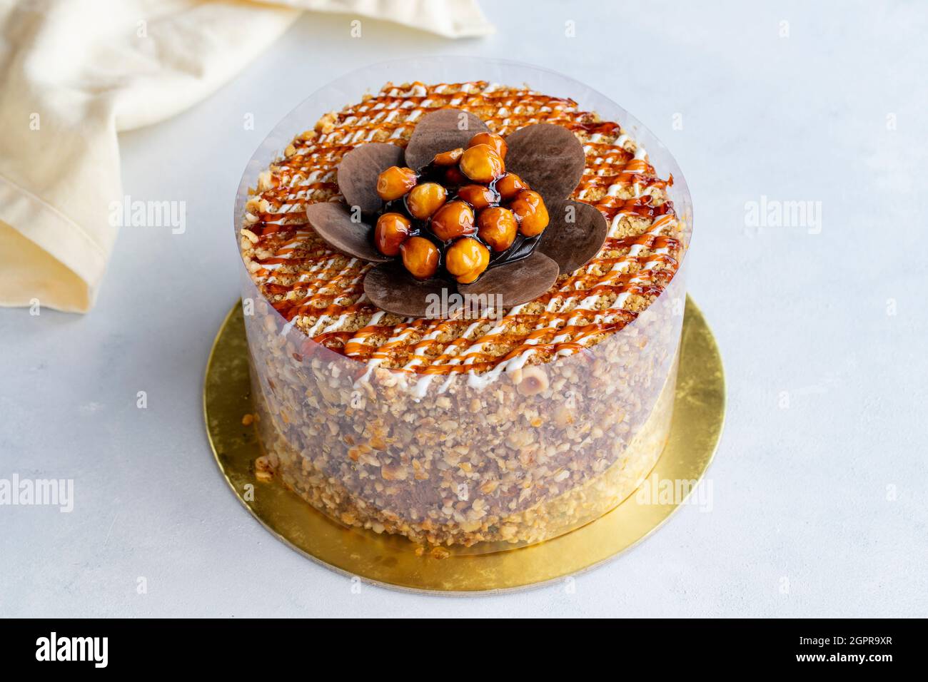 Chocolate cake with croquant on a white background Stock Photo - Alamy