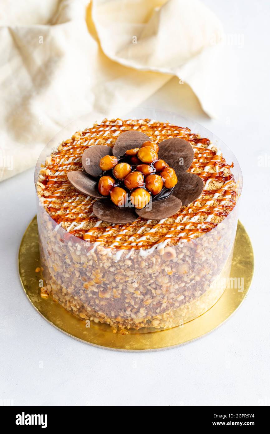 Chocolate cake with croquant on a white background Stock Photo - Alamy