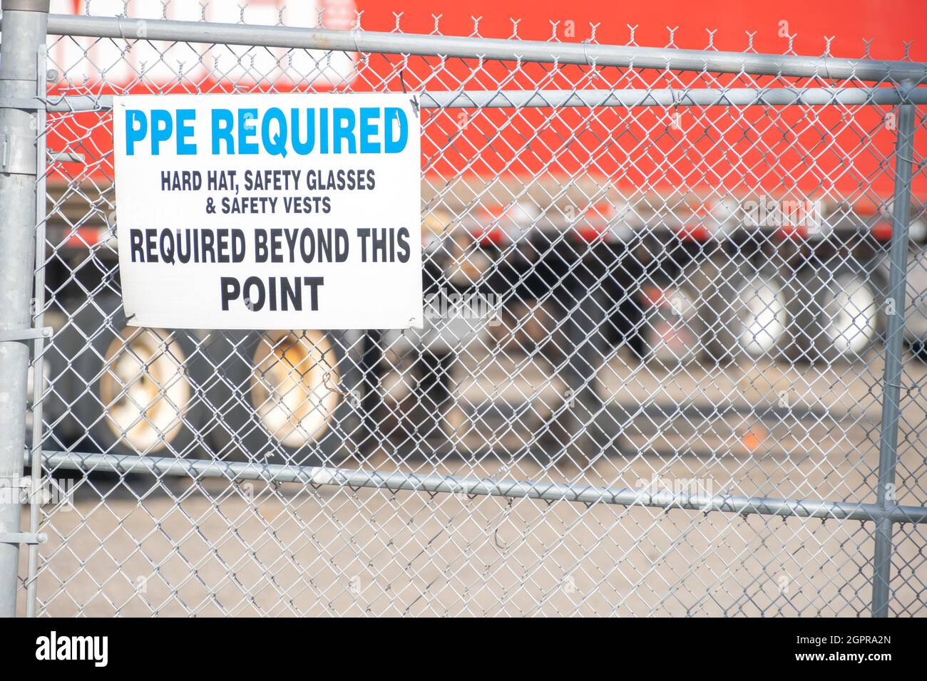Safety sign on factory fence in industrial area Stock Photo - Alamy