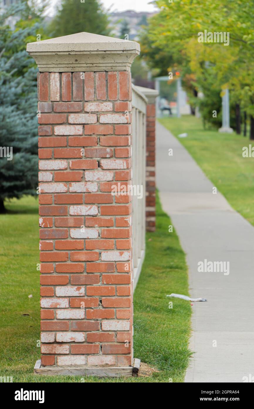 Fence beside a pavement on a city street Stock Photo - Alamy