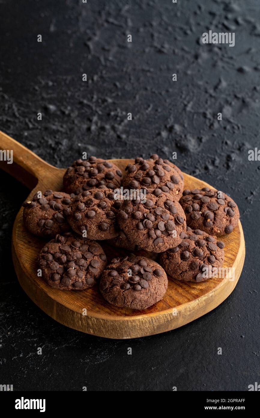 Chocolate chip cookies on dark background Stock Photo - Alamy