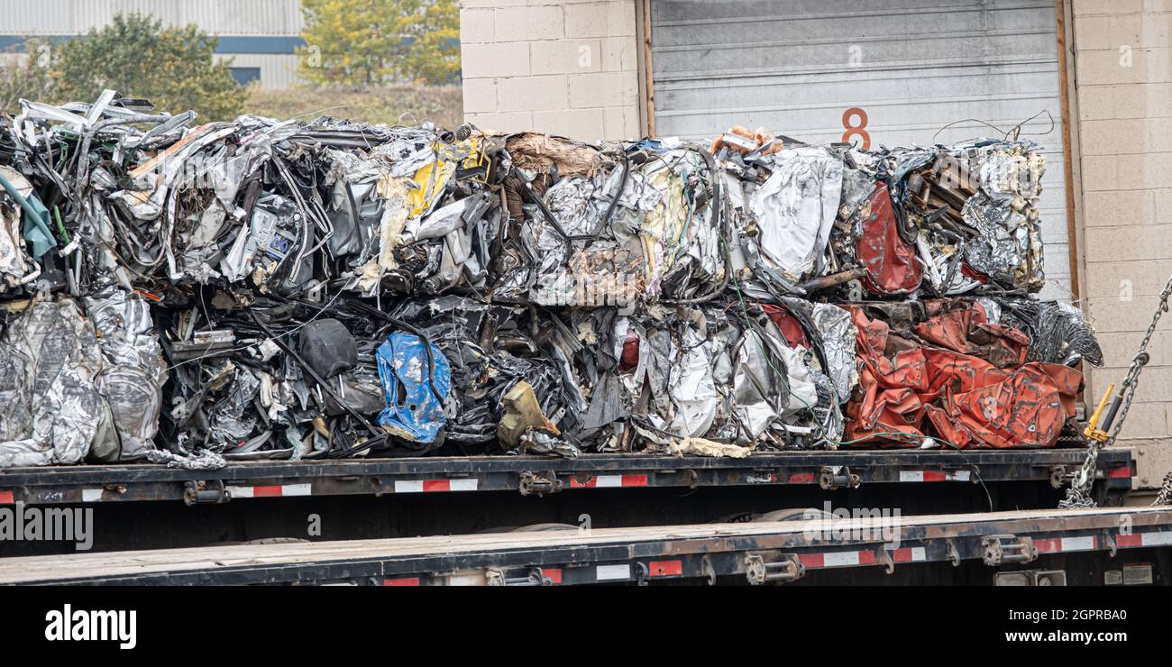 Compressed cubes of scrap metal at a junk yard Stock Photo - Alamy