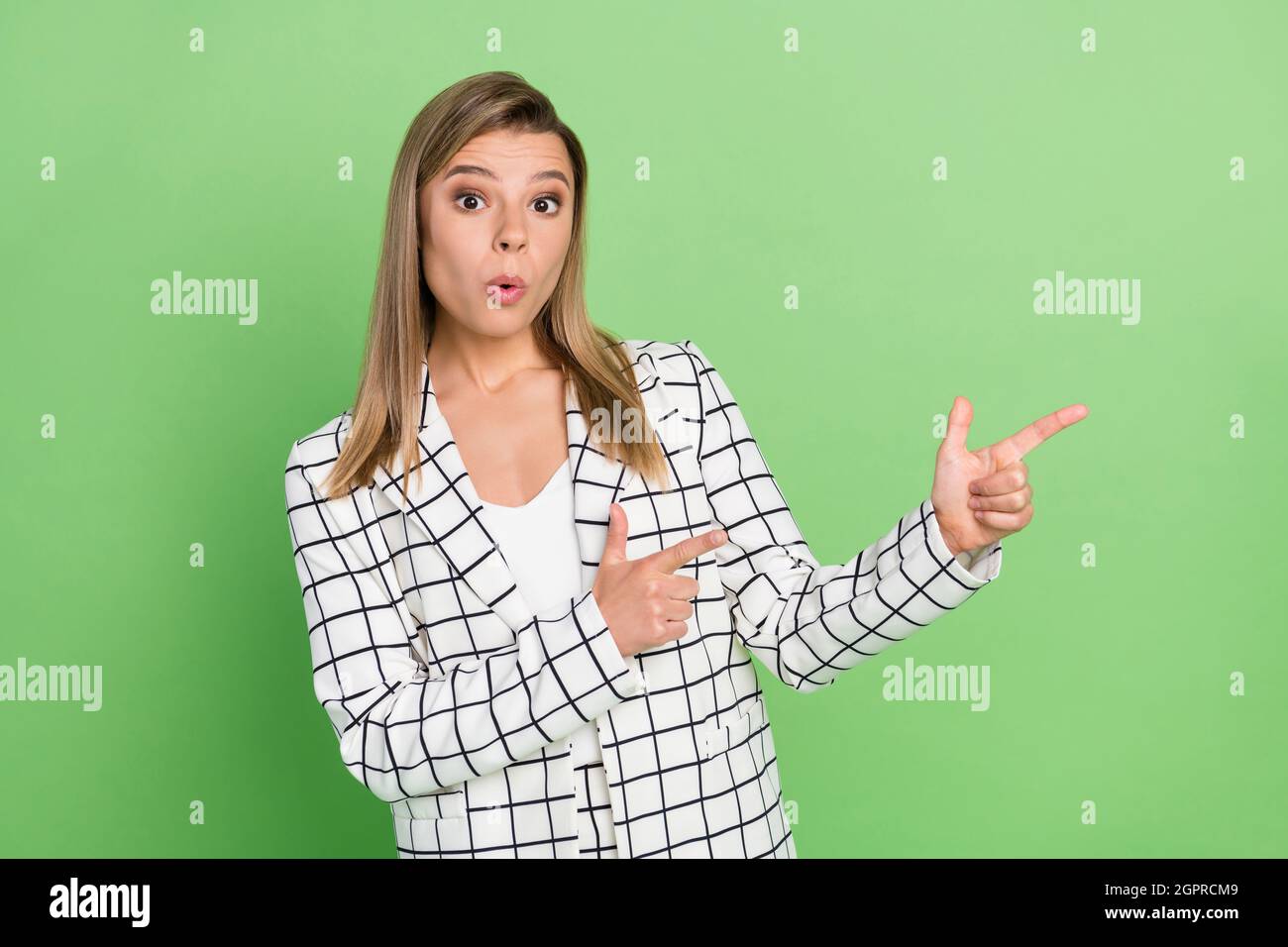 Portrait of attractive amazed classy lady demonstrating copy blank ...