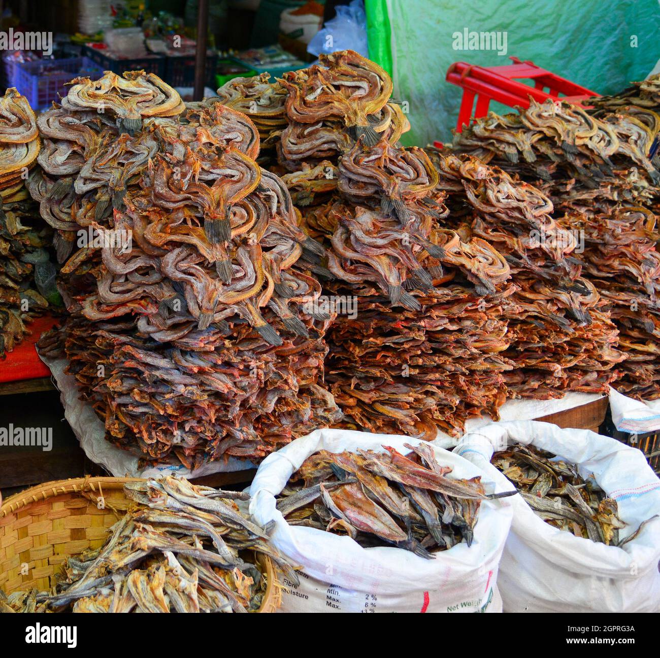Selling salty fish at rural market in Taunggyi, Myanmar. Taunggyi is ...