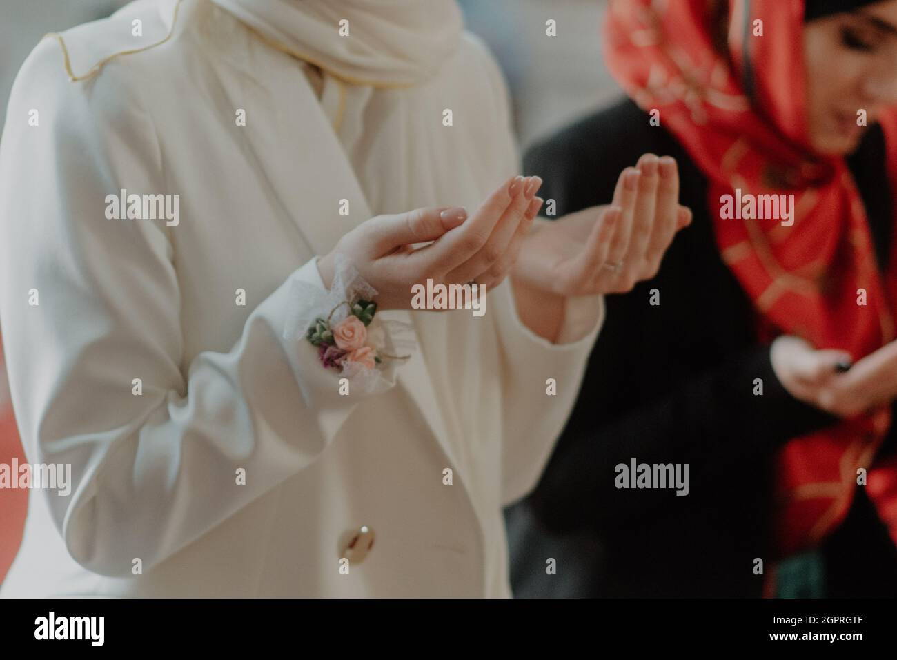 Praying with their hands up during a ceremon Stock Photo - Alamy