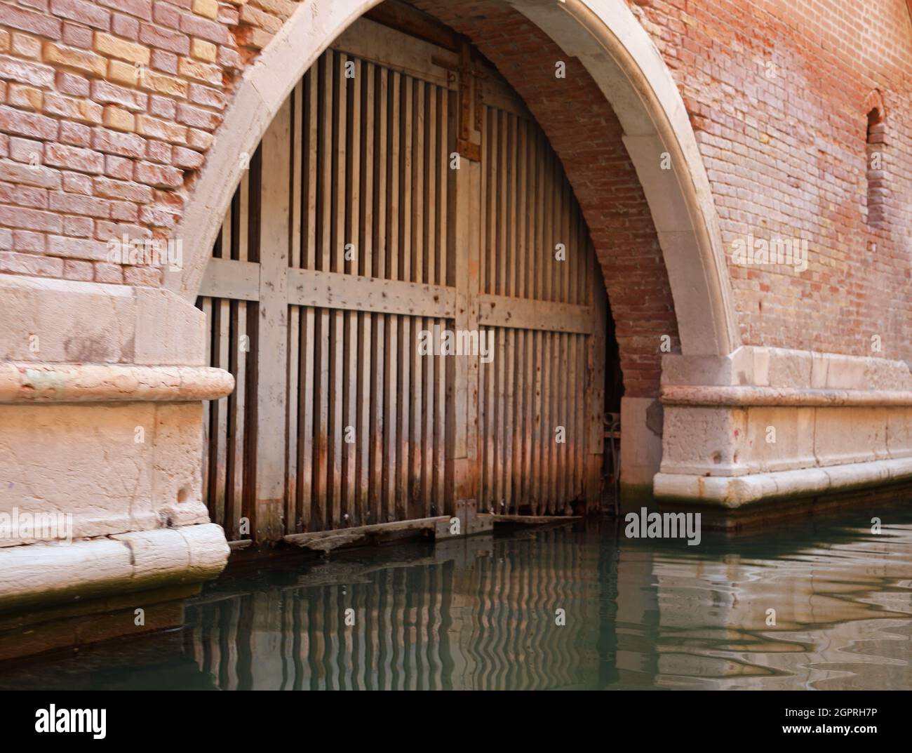 wooden gate of the main door that directly accesses the navigable canal ...