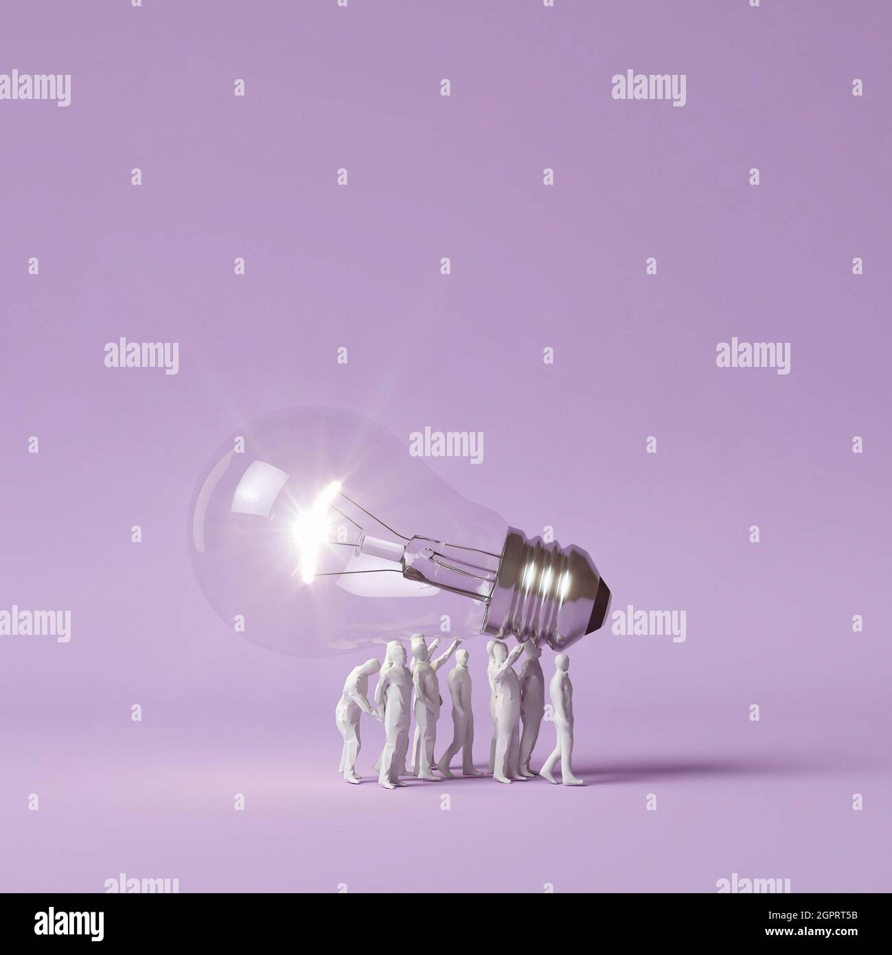 Human figurines carrying lit lightbulb as idea concept Stock Photo - Alamy