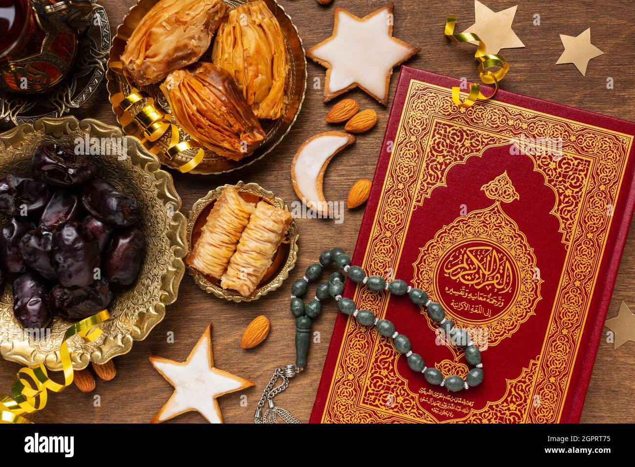 Islamic new year decoration with traditional food and quran Stock Photo ...