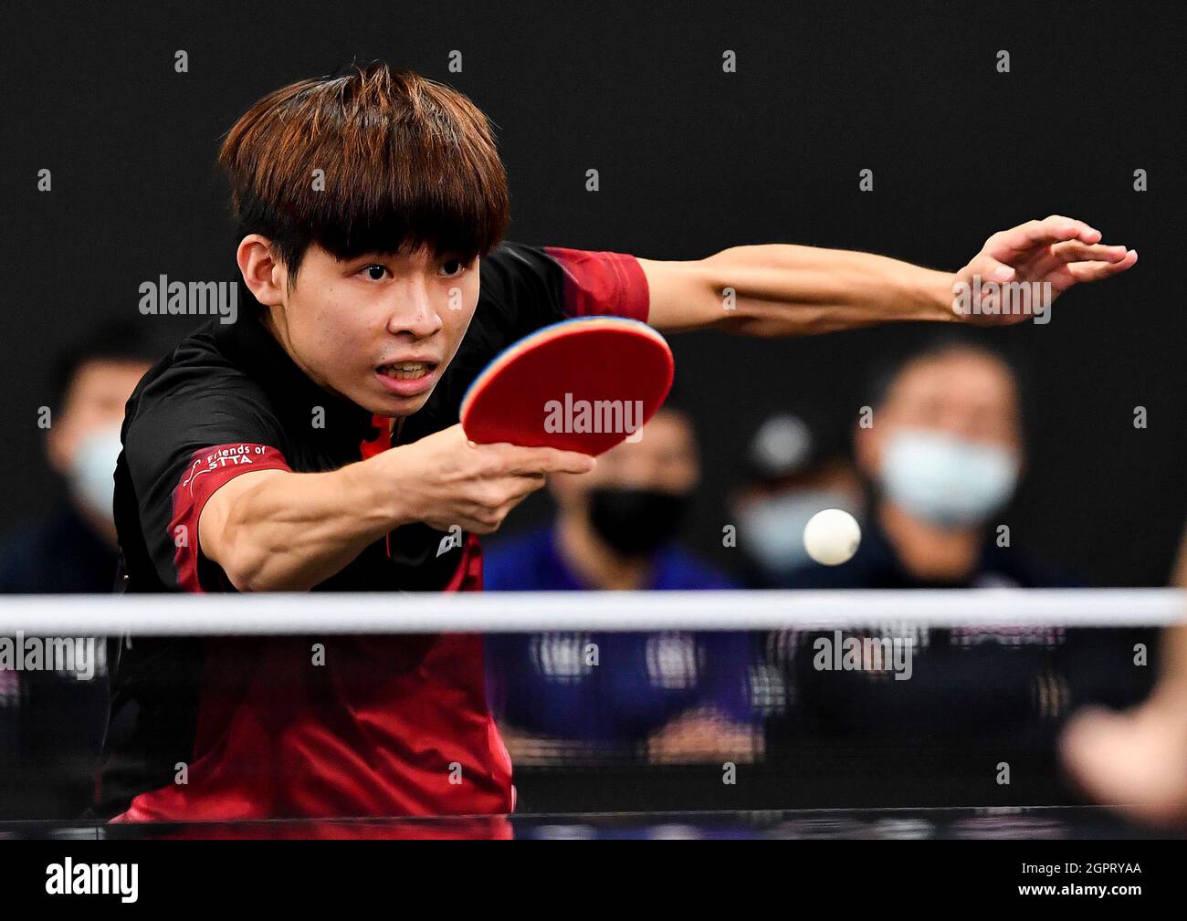 Doha, Qatar. 30th Sep, 2021. Beh Kun Ting of Singapore competes against ...