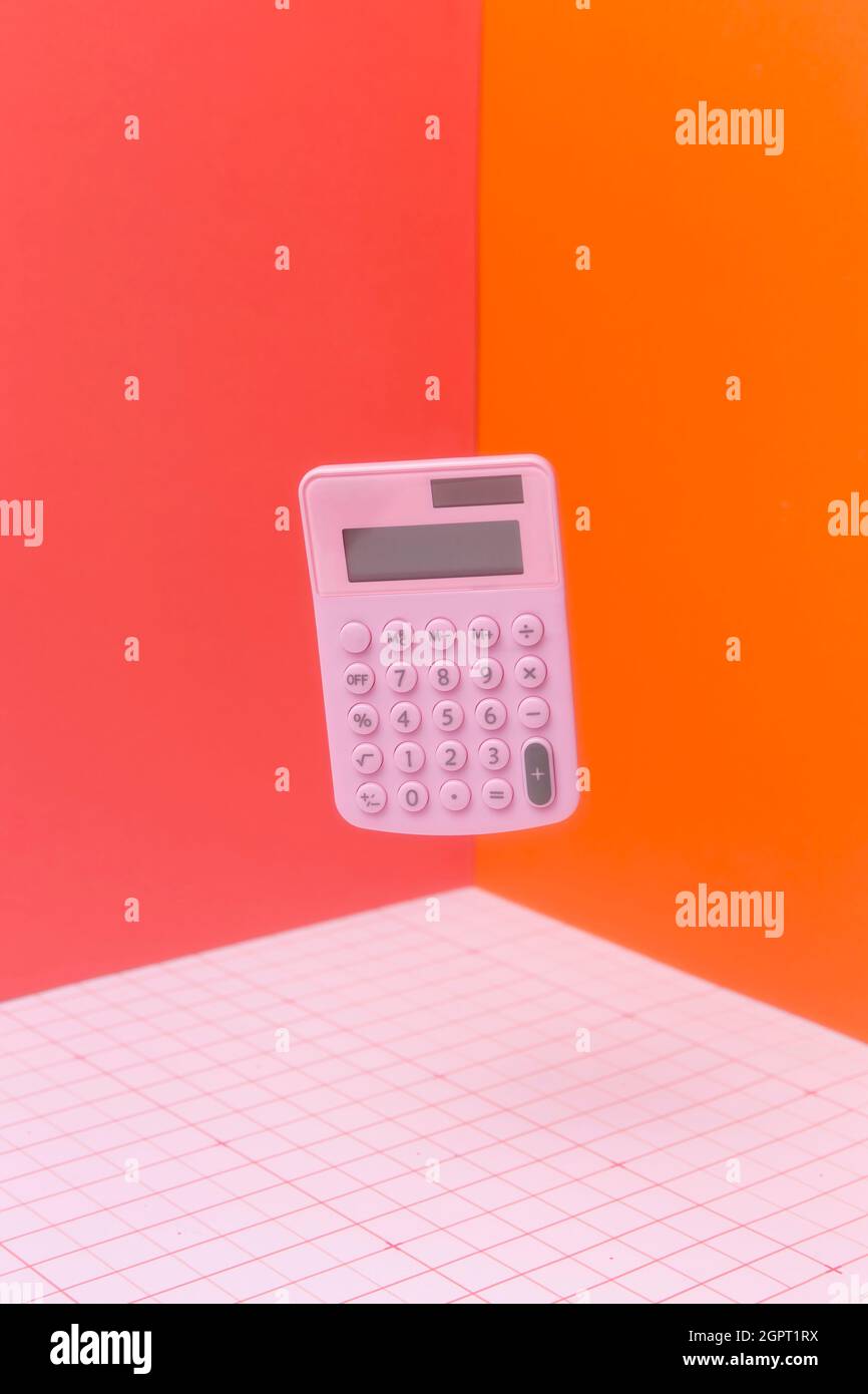 Math arrangement with calculator floating Stock Photo - Alamy