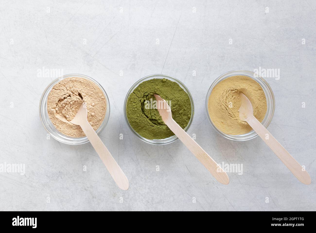 Natural spa coloured sand different bowls Stock Photo - Alamy