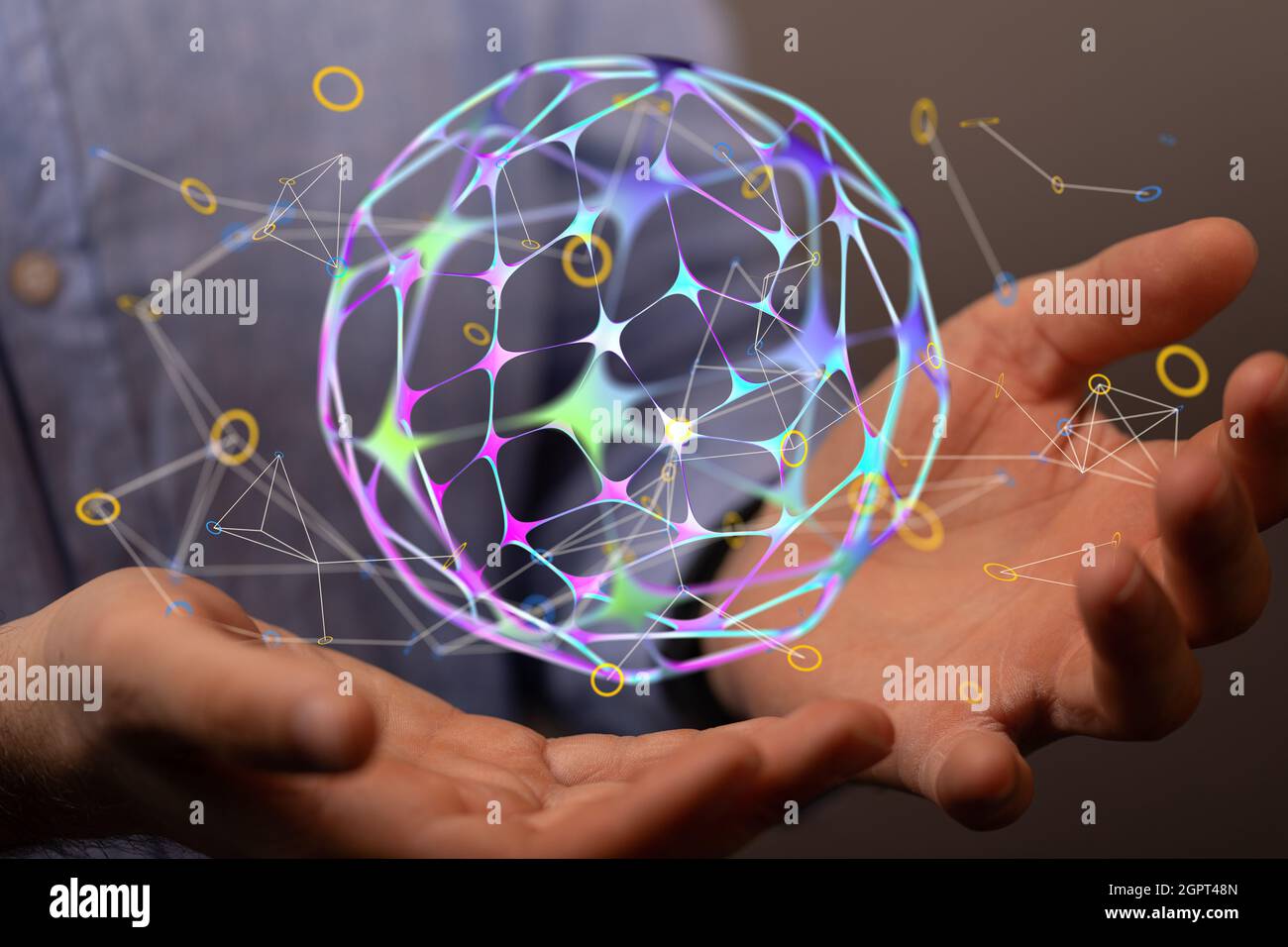 Closeup shot of 3d rendered connected cells with links in man's hand ...