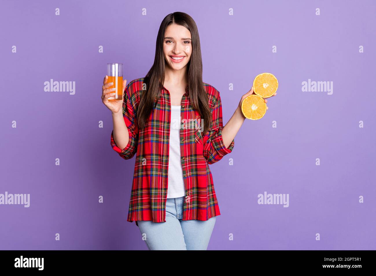 Photo of sweet brunette hairdo young lady hold oranges juice wear red ...