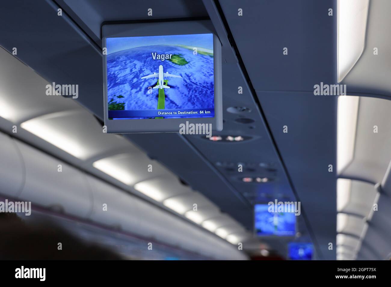Monitor inside an aircraft cabin showing flight position shortly before ...