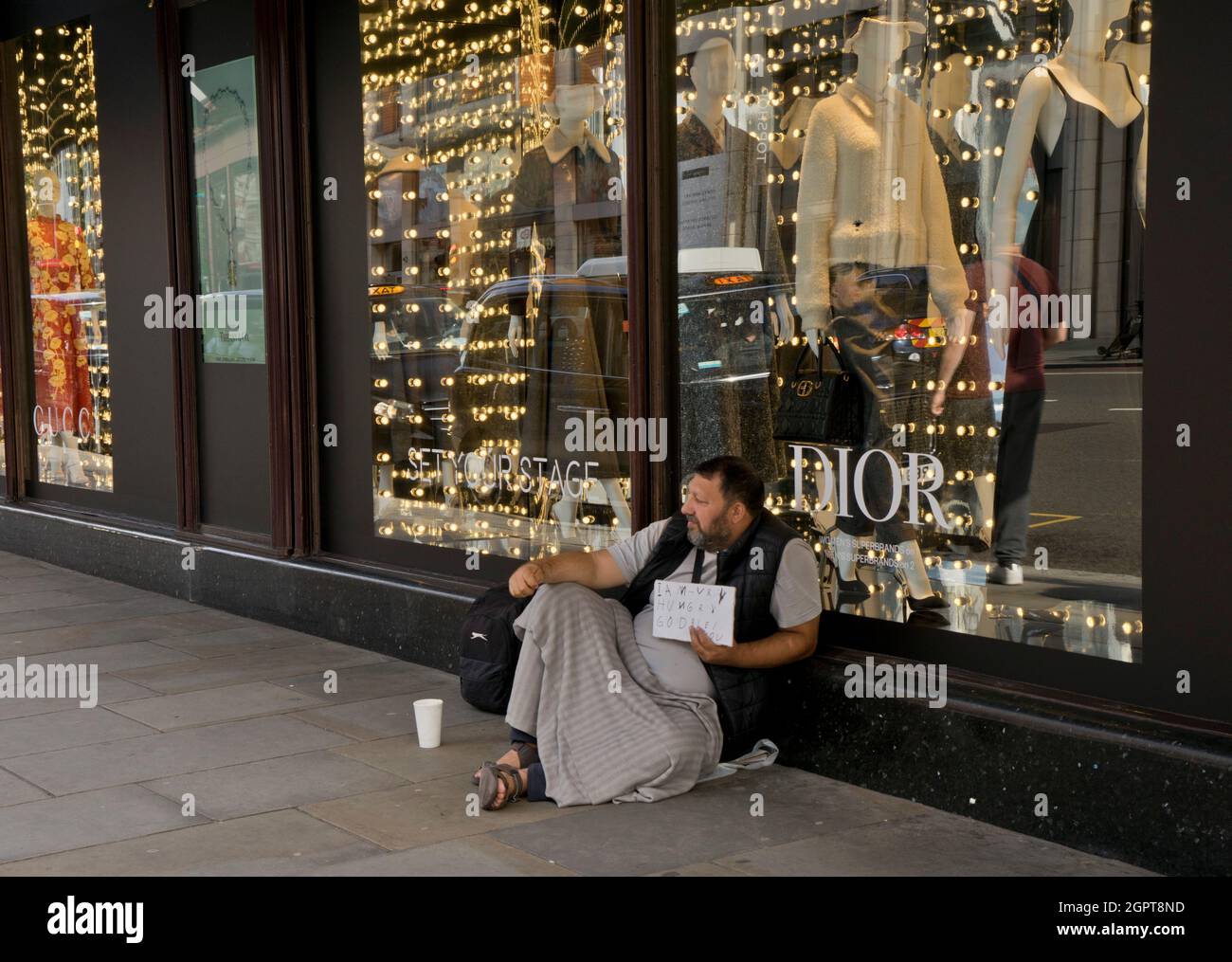 Homeless man begging outside world famous Harrods department store in ...