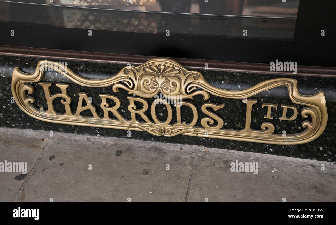 Sign outside with brand name of the world famous Harrods department ...