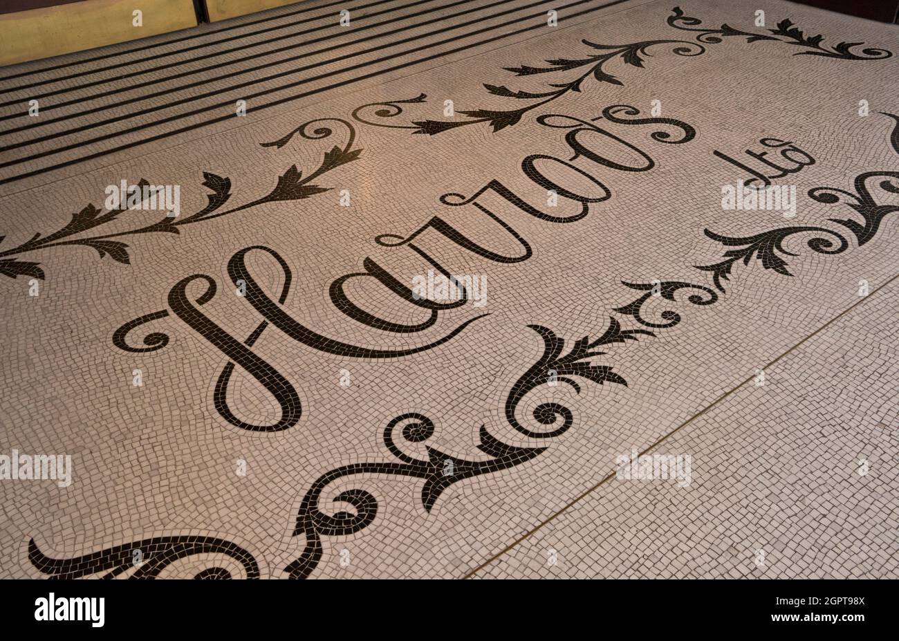 Sign outside with brand name of the world famous Harrods department ...