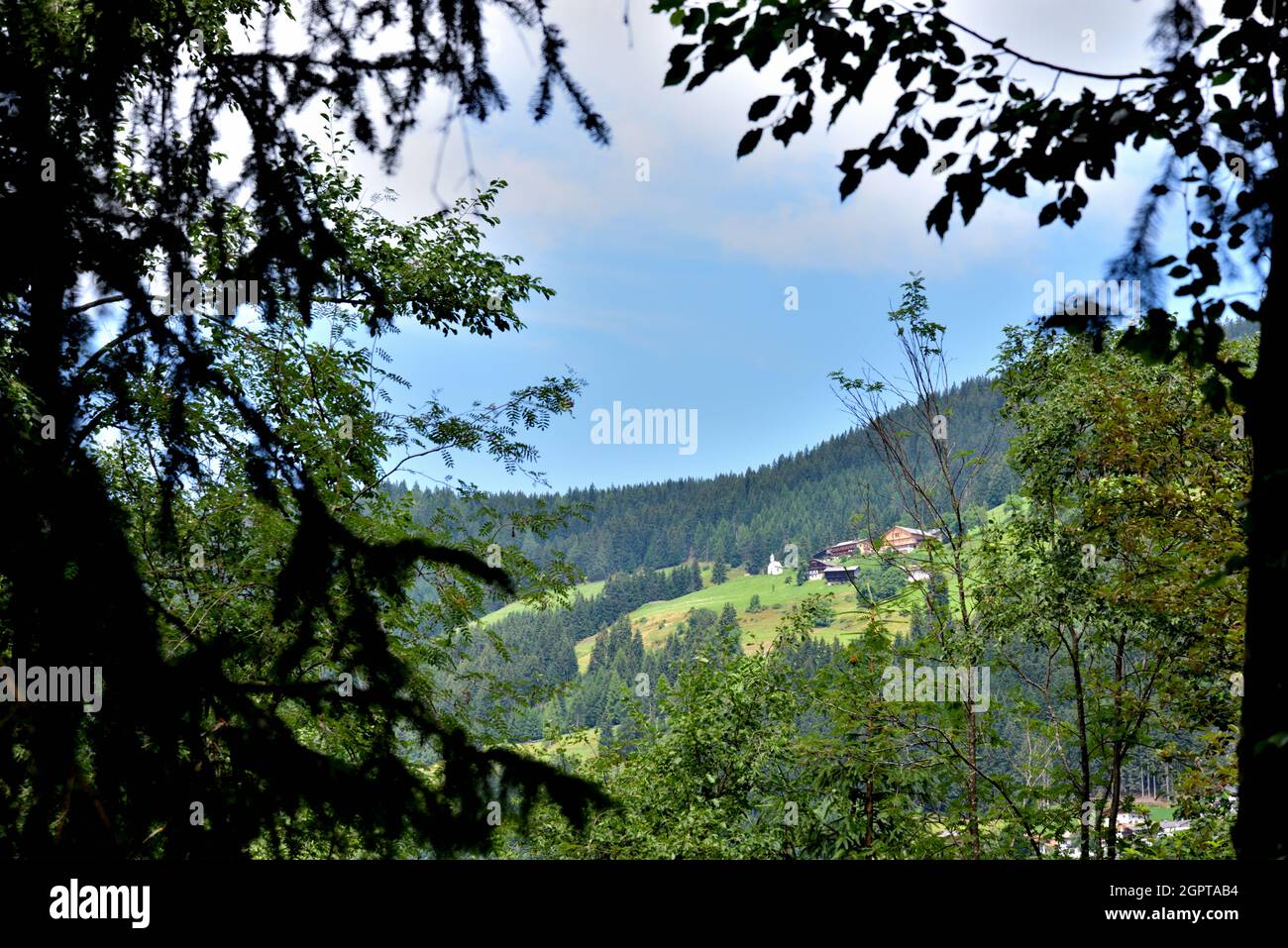 Small cluster of houses on the mountain coast near the village of Moso ...