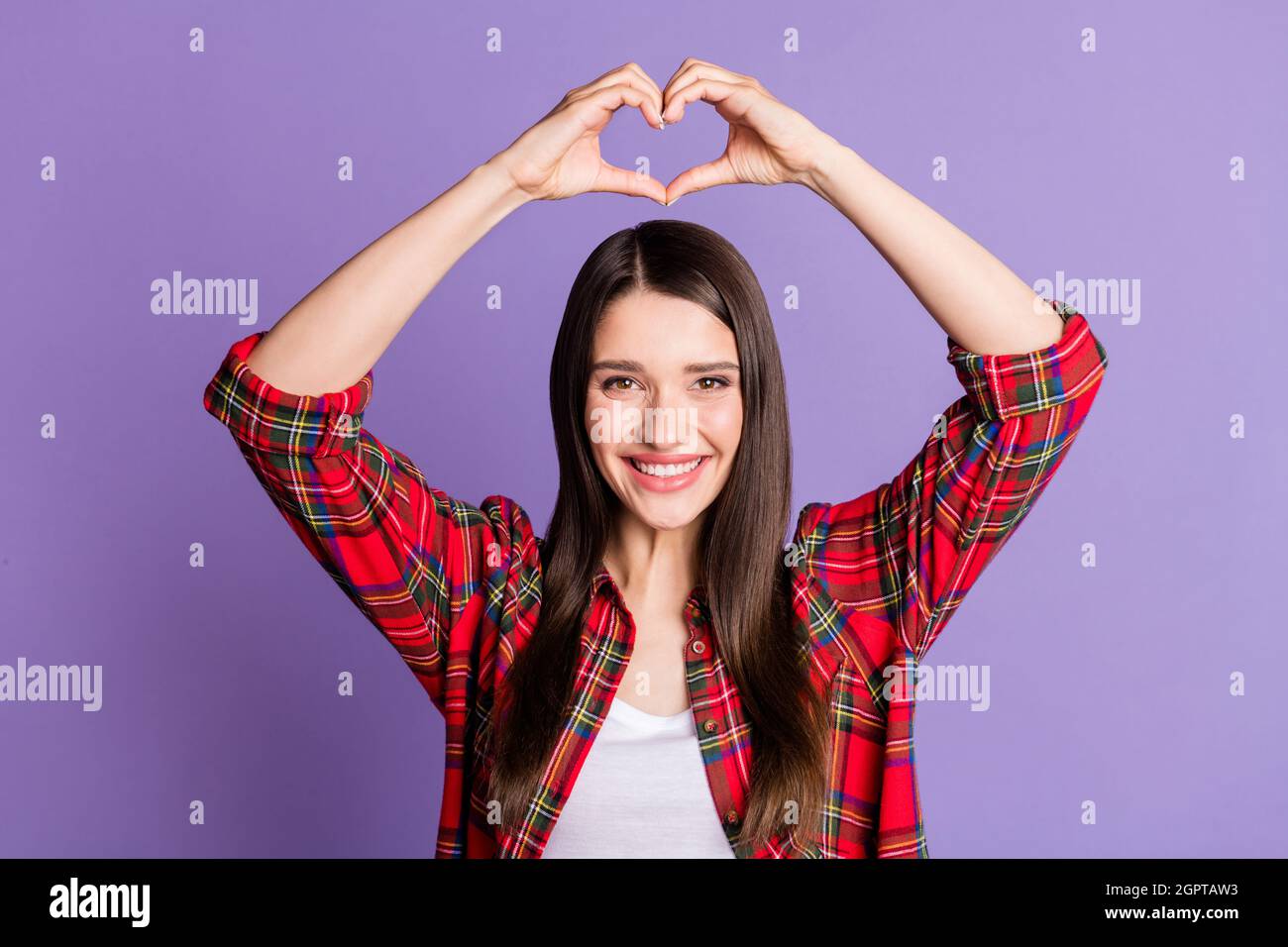 Photo of flirty brunette hairdo millennial lady show heart wear red ...