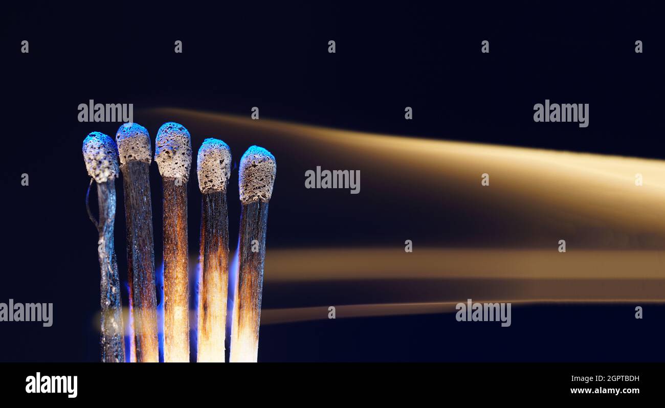 Lit matches and blown out in the studio photographed with colorful ...