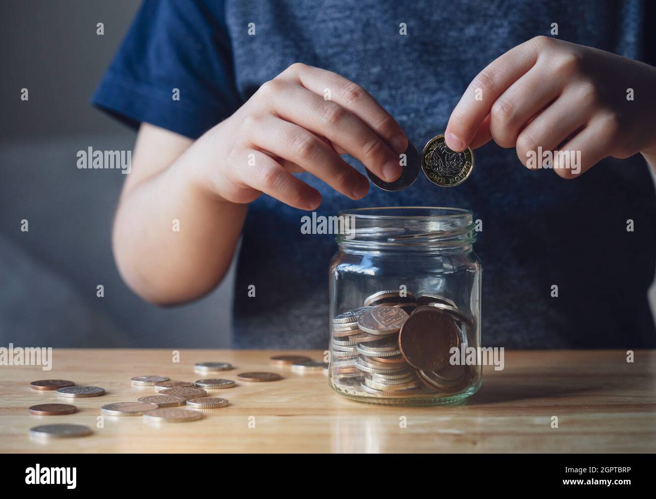 Child counting money uk hi-res stock photography and images - Alamy
