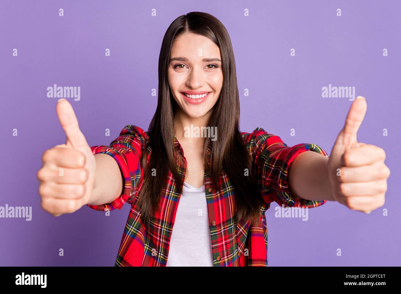 Photo of funny brunette hairdo young lady show thumb up wear red shirt ...