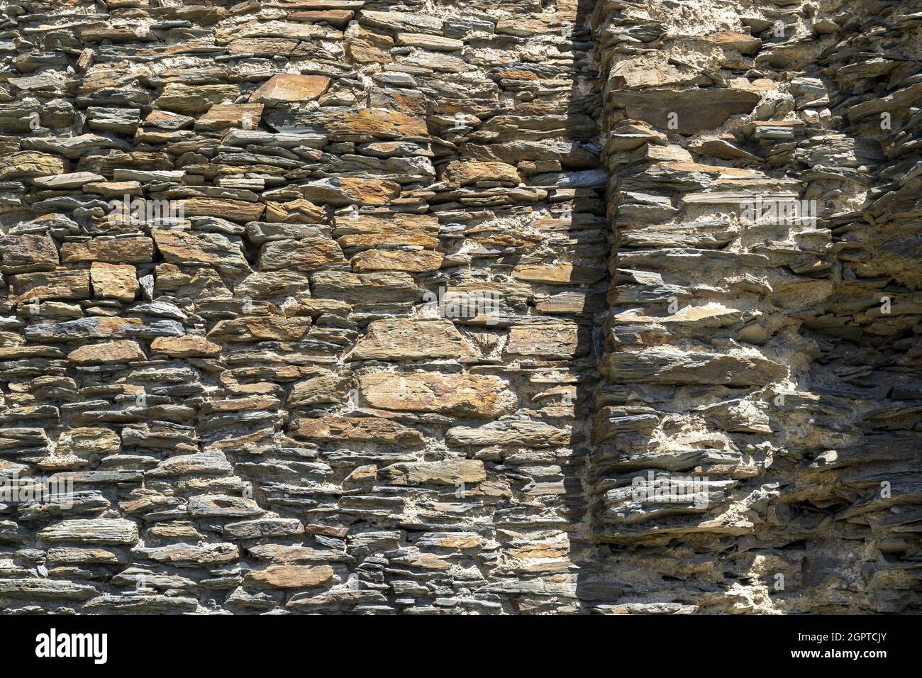 Closeup shot of a rough stone wall Stock Photo - Alamy