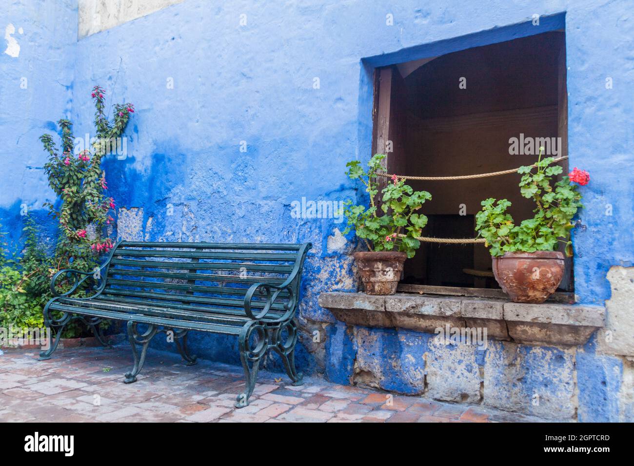 Flowers and a bench in Santa Catalina monastery in Arequipa, Peru Stock ...