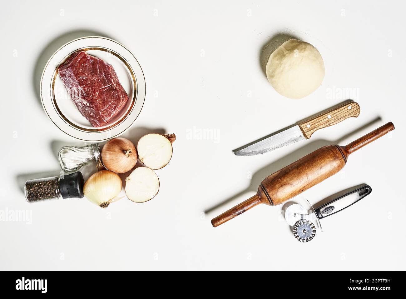 Overhead shot of fresh raw meat with ingredients isolated on white ...