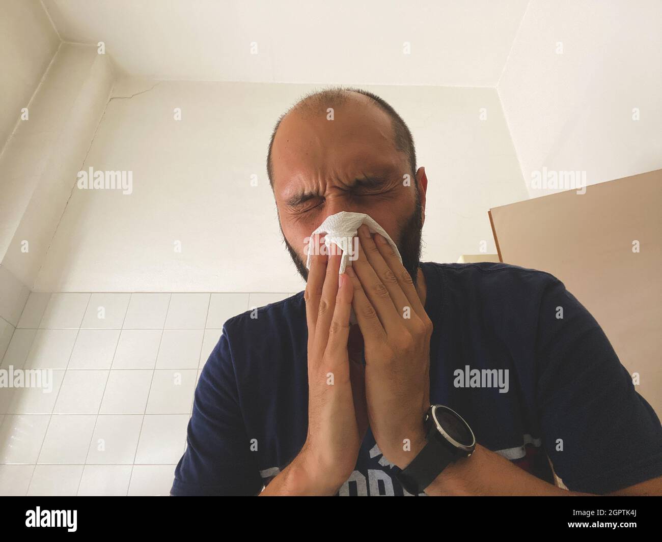 Sneezing into arm hi-res stock photography and images - Alamy