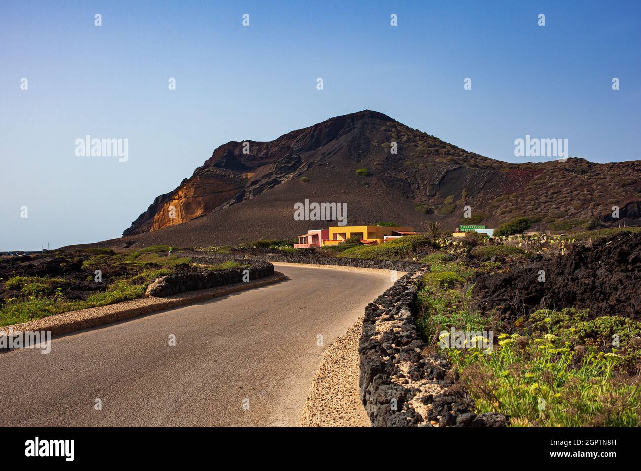 Road with dry stone wall . The Monte Nero Volcano on the background ...